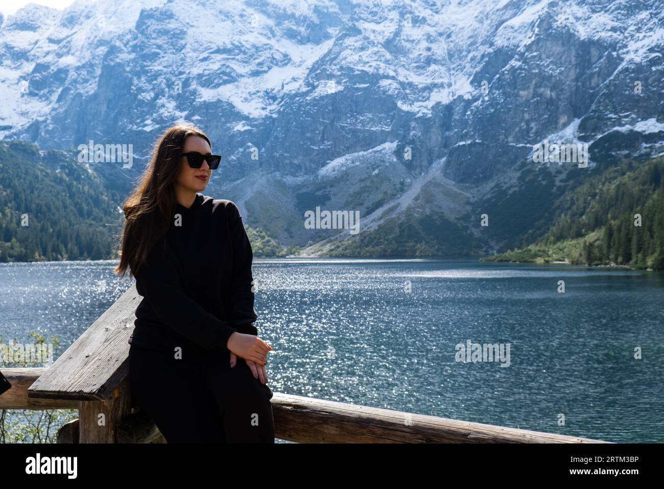 Young woman enjoying nature in Morskie Oko Snowy Mountain Hut in Polish ...