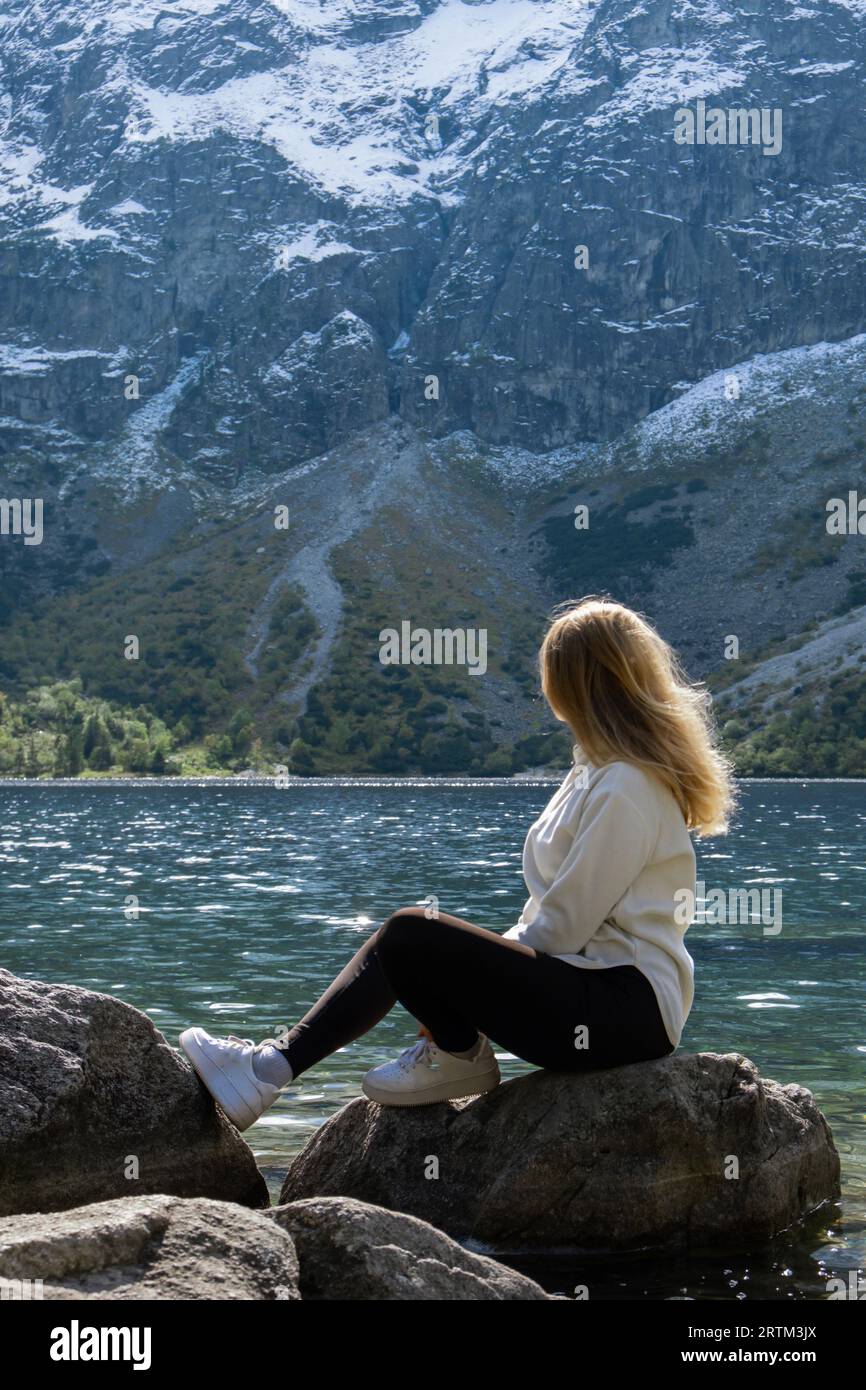 Young woman enjoying nature in Morskie Oko Snowy Mountain Hut in Polish ...