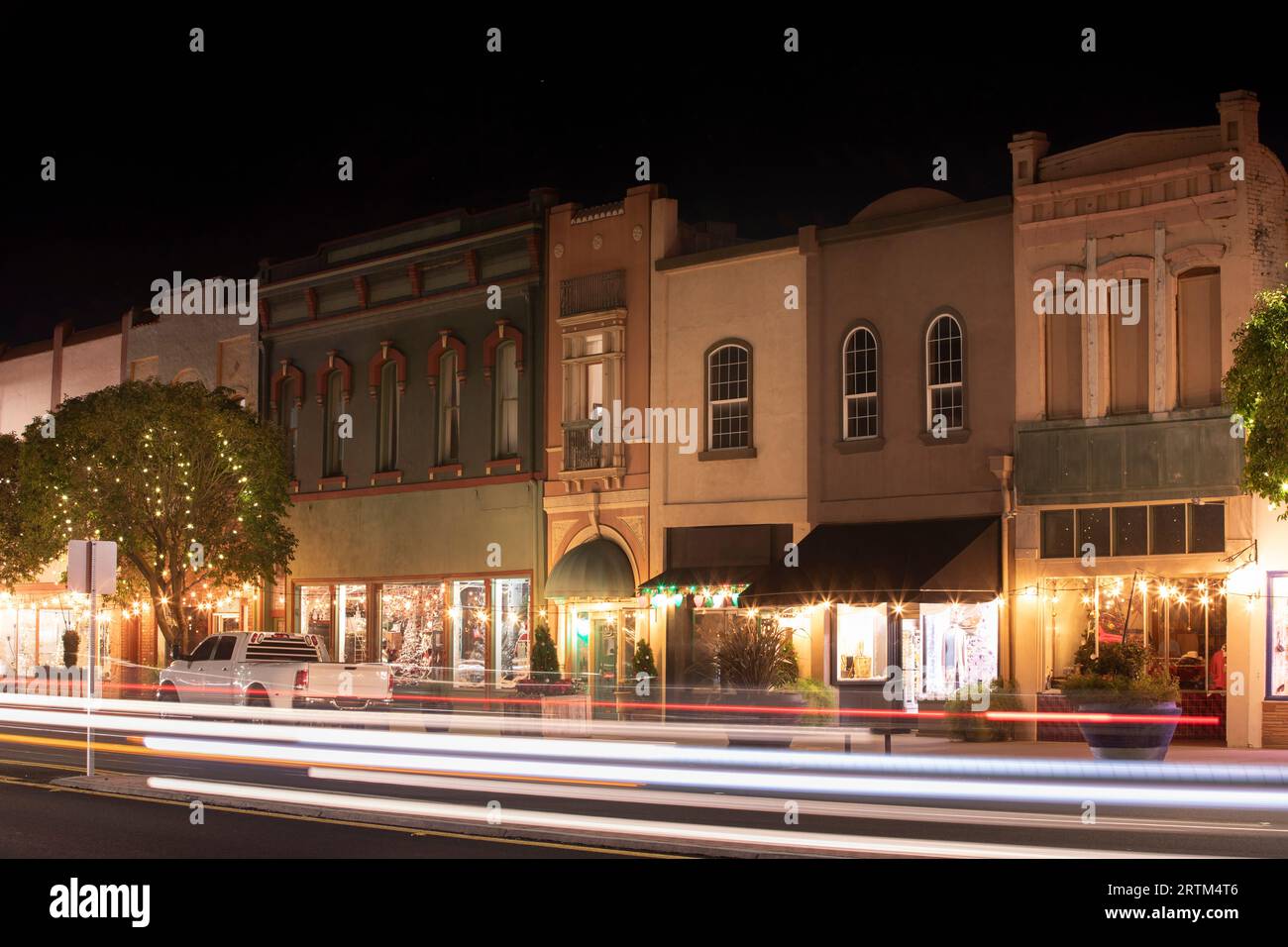Night time traffic streams through historic downtown Red Bluff ...