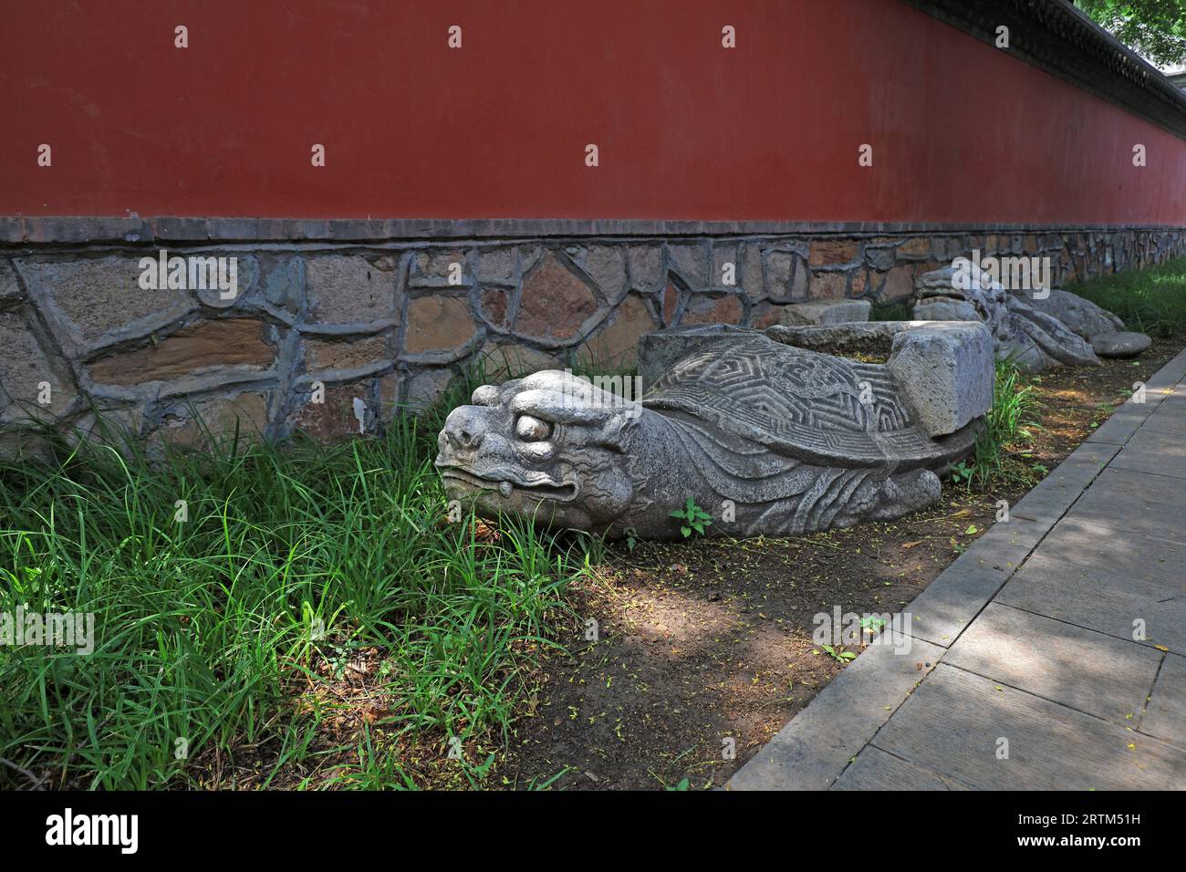 The stone turtle sculpture is in the corner of the temple, Lying Buddha ...