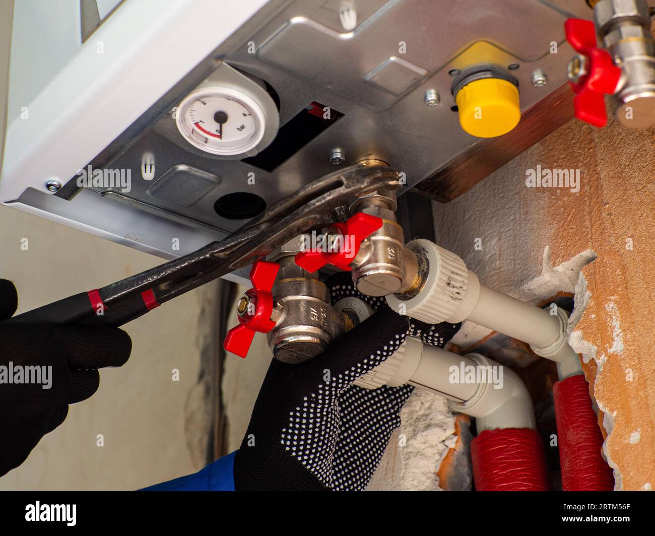 Installing heating and water pipes in apartment Stock Photo - Alamy