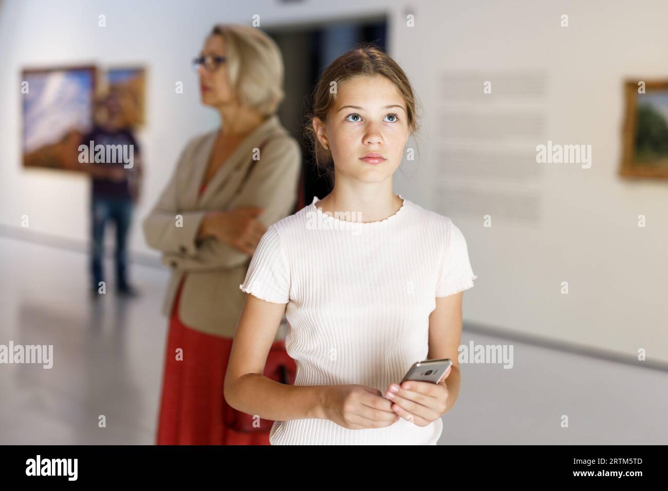 Teenage girl visiting museum Stock Photo - Alamy