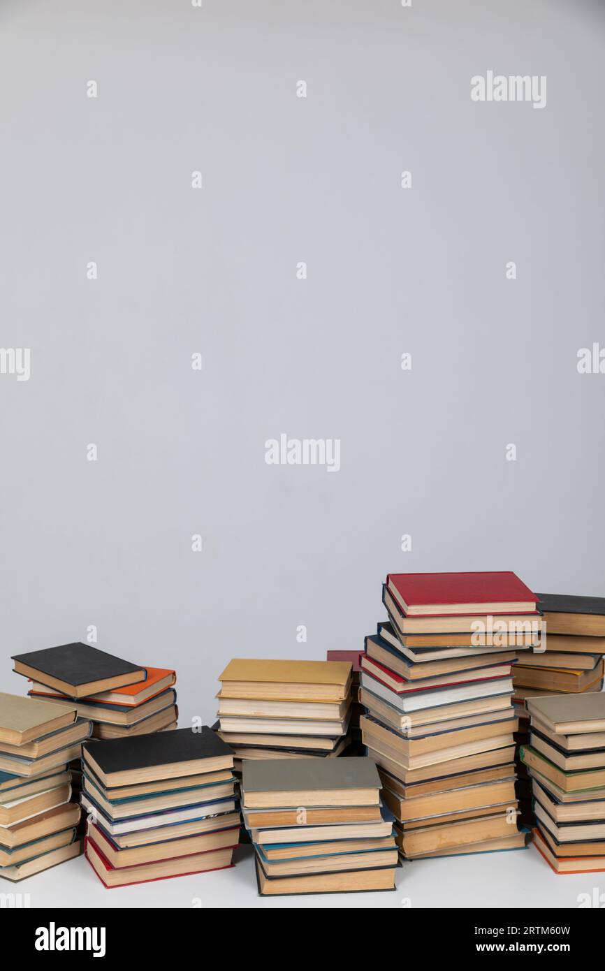 reading the science of knowledge many books stacked in a library on a ...