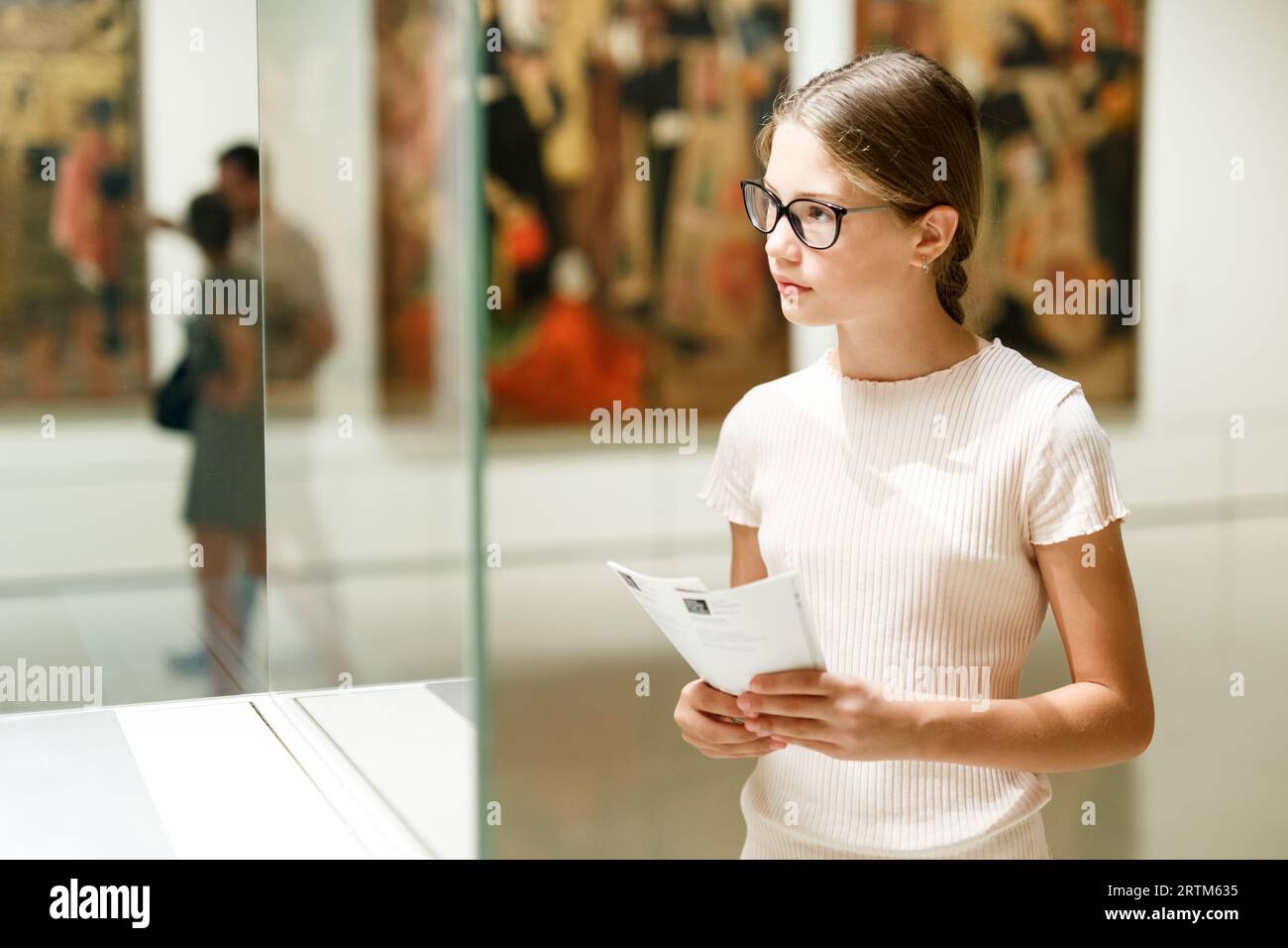 Teenage girl visiting museum Stock Photo - Alamy