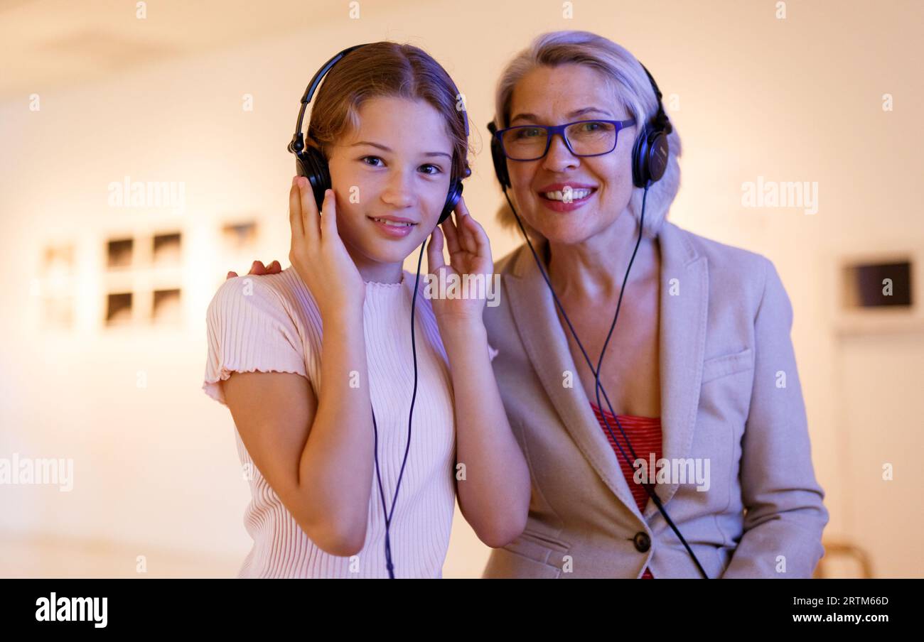 People using audio guide in museum Stock Photo - Alamy
