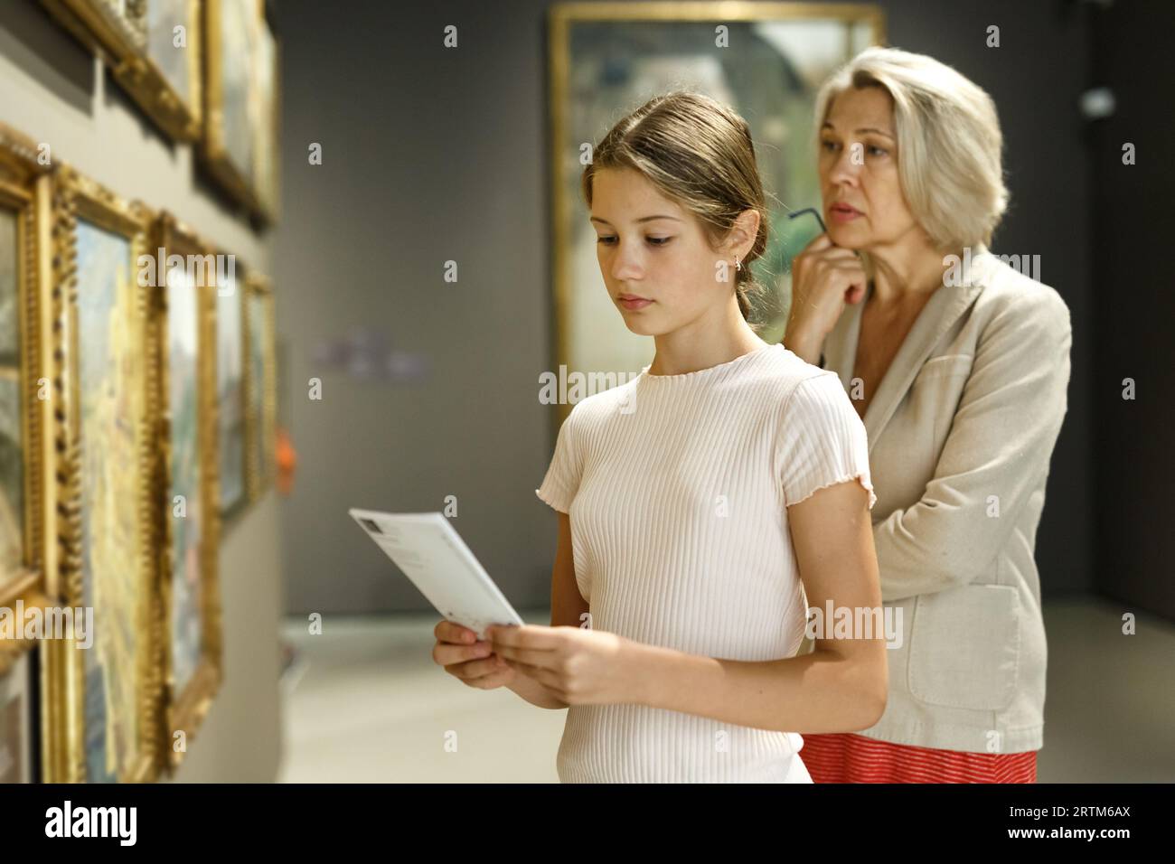 Teenage girl visiting museum Stock Photo - Alamy