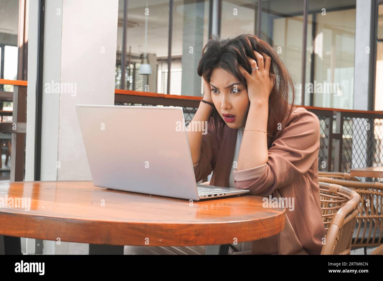 A portrait of Asian business woman looks stressed and depressed while ...