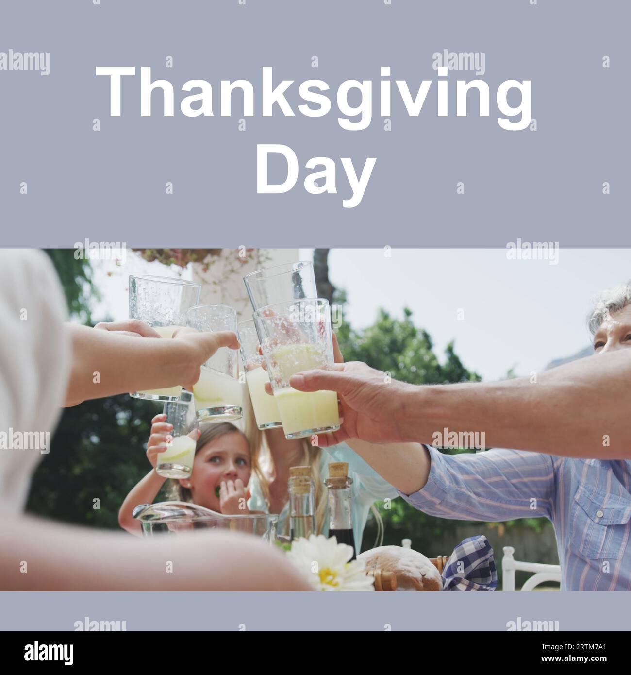 Thanksgiving day text on grey and caucasian family making a toast at ...