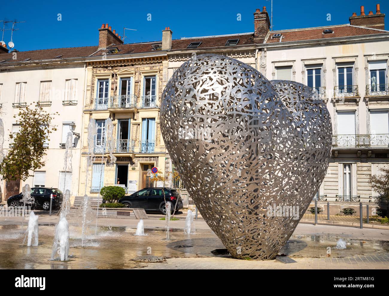 The sculpture known as the "Heart of Troyes" next to a water fountain ...