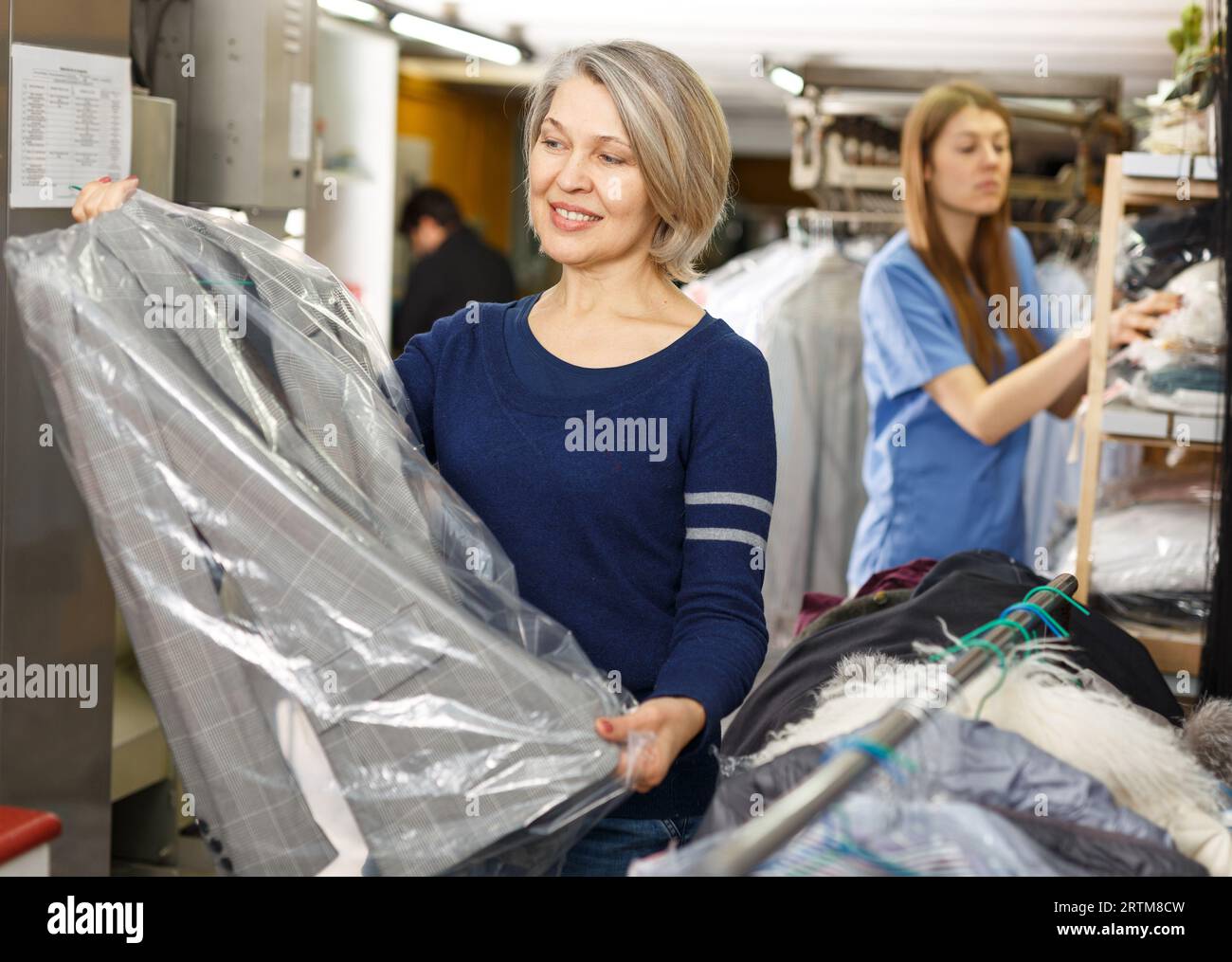 Portrait of female laundry customer Stock Photo - Alamy
