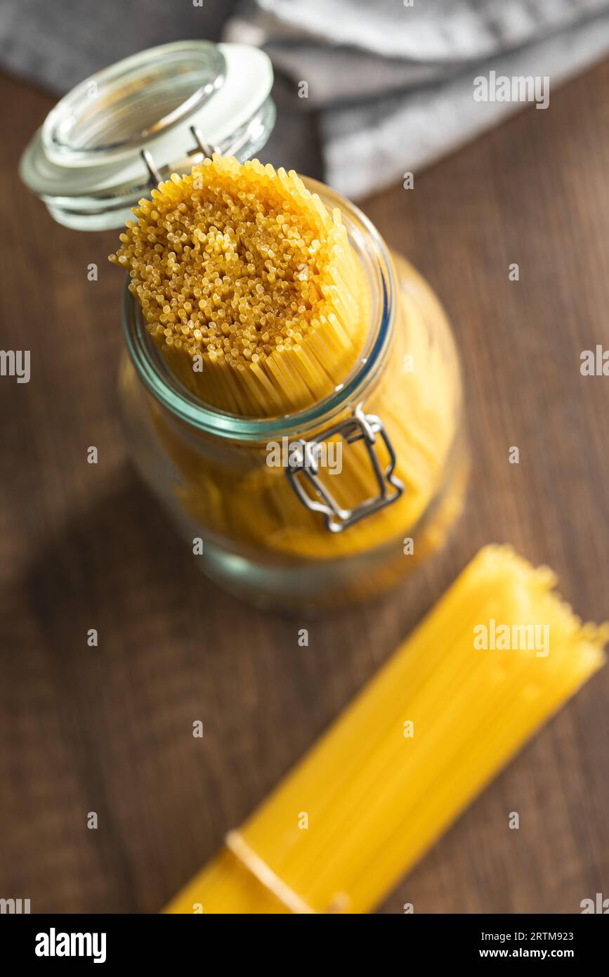 Spaghetti pasta. Uncooked italian pasta in a glass bottle Stock Photo ...