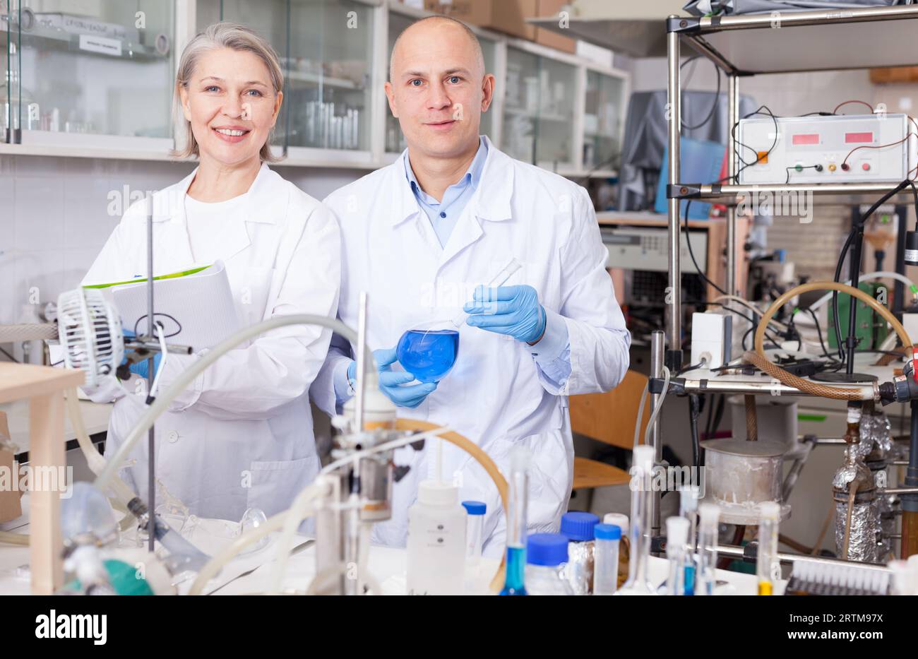 Confident male and female scientists Stock Photo - Alamy