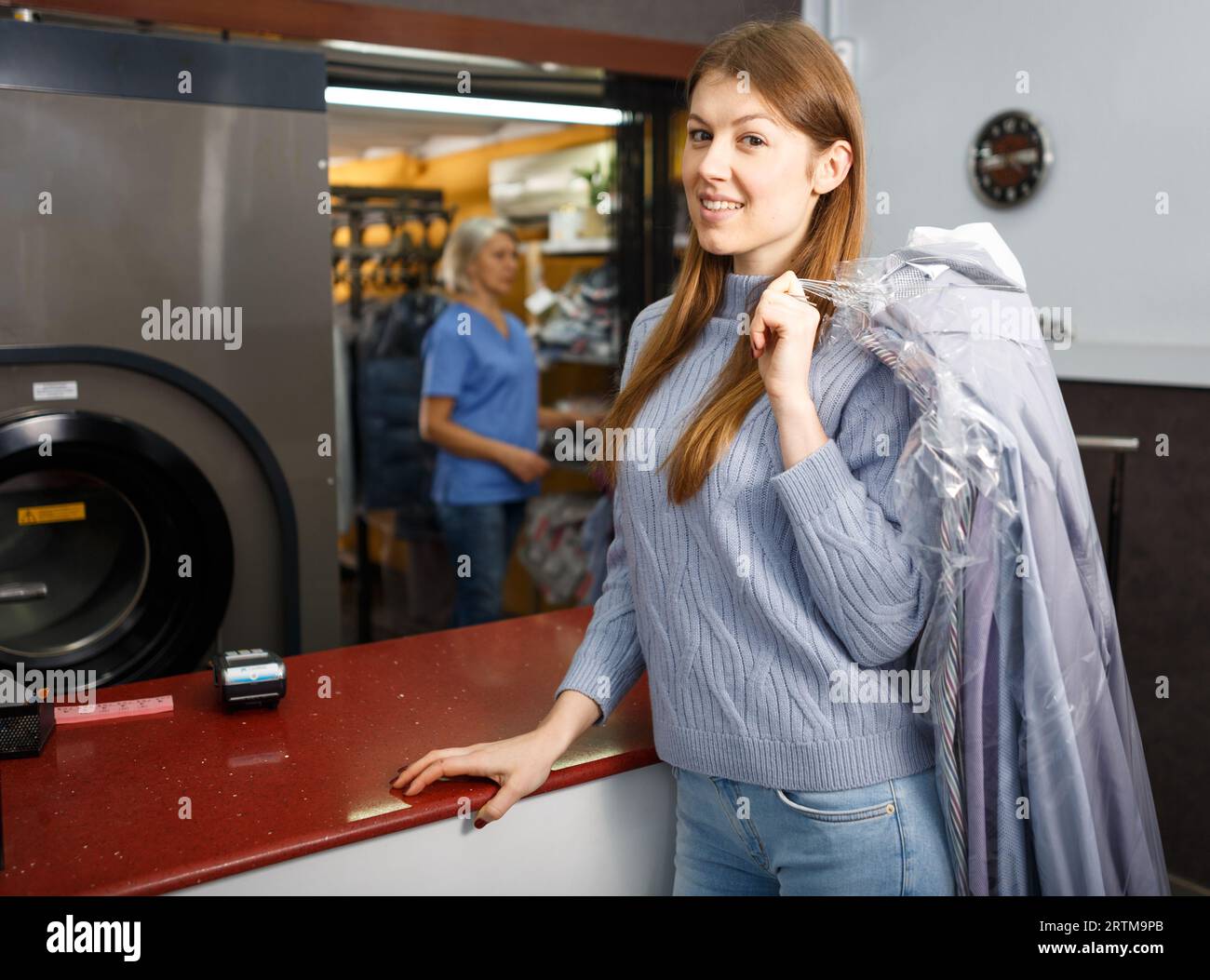 Portrait of female laundry customer Stock Photo - Alamy