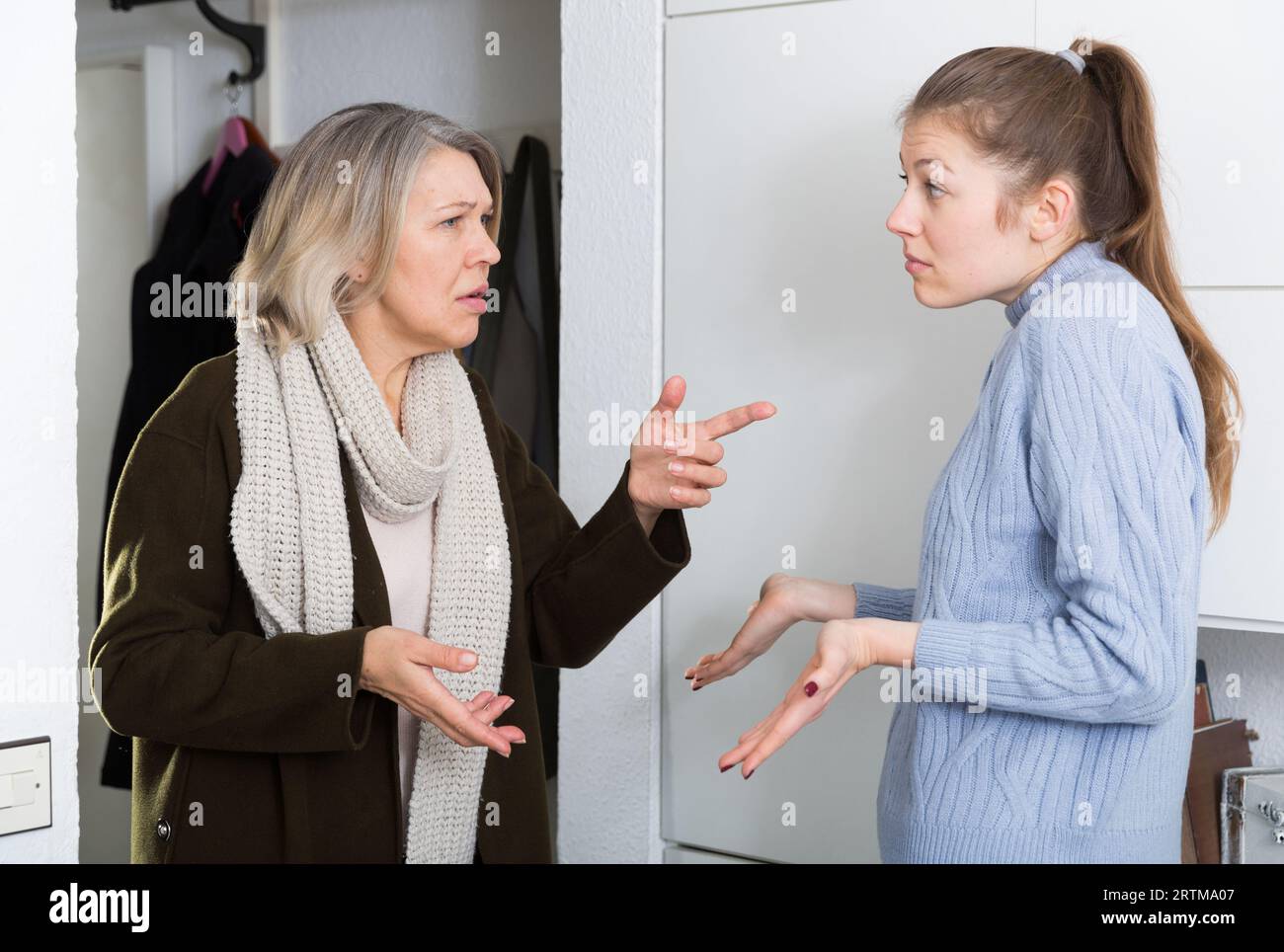 Women having emotional conversation Stock Photo - Alamy