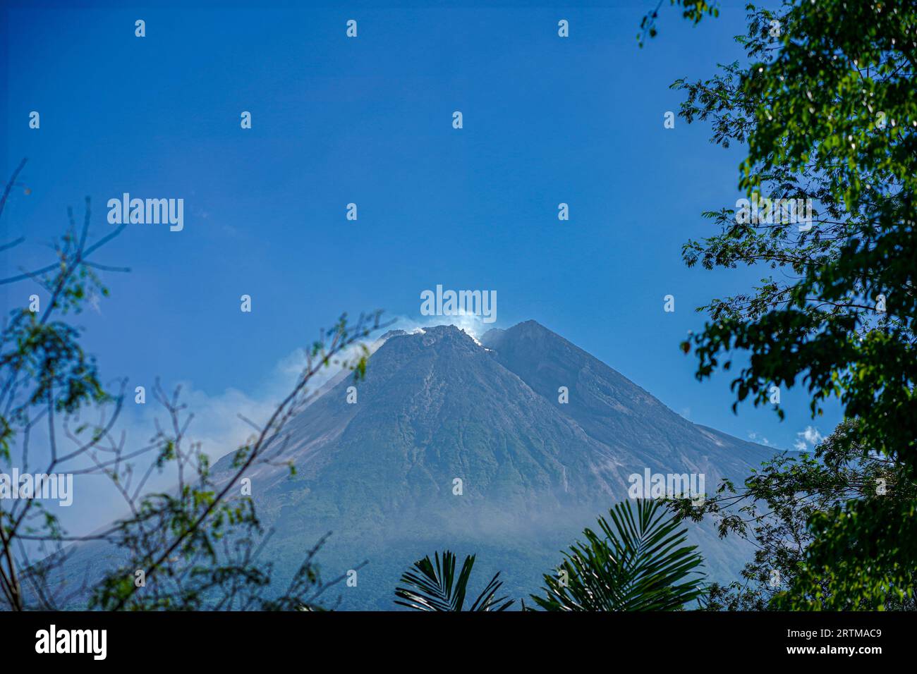 awesome view of Mount Merapi in the morning and emitting smoke, a ...