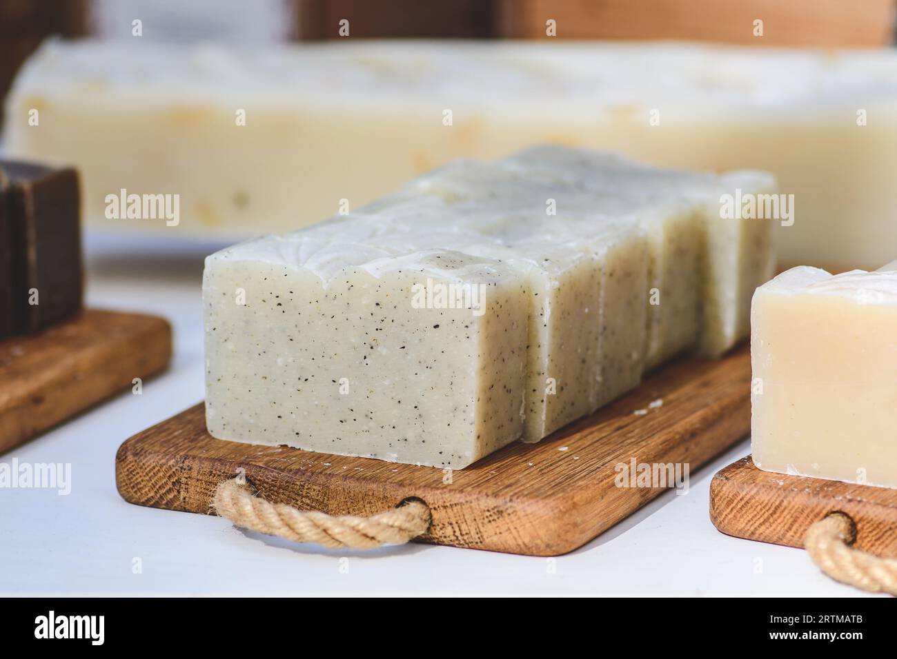Organic handmade soap on a wooden board in a folk arts and crafts fair ...