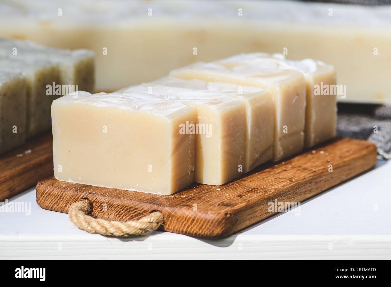 Organic handmade soap on a wooden board in a folk arts and crafts fair ...