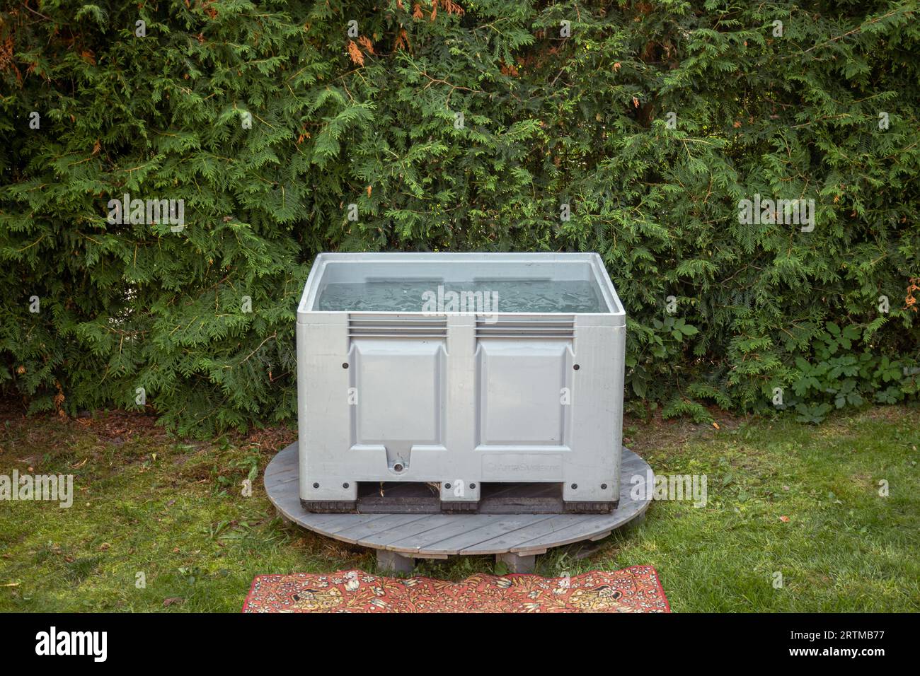 Portable plastic bath tub or tank in a garden ready for ice bathing in ...