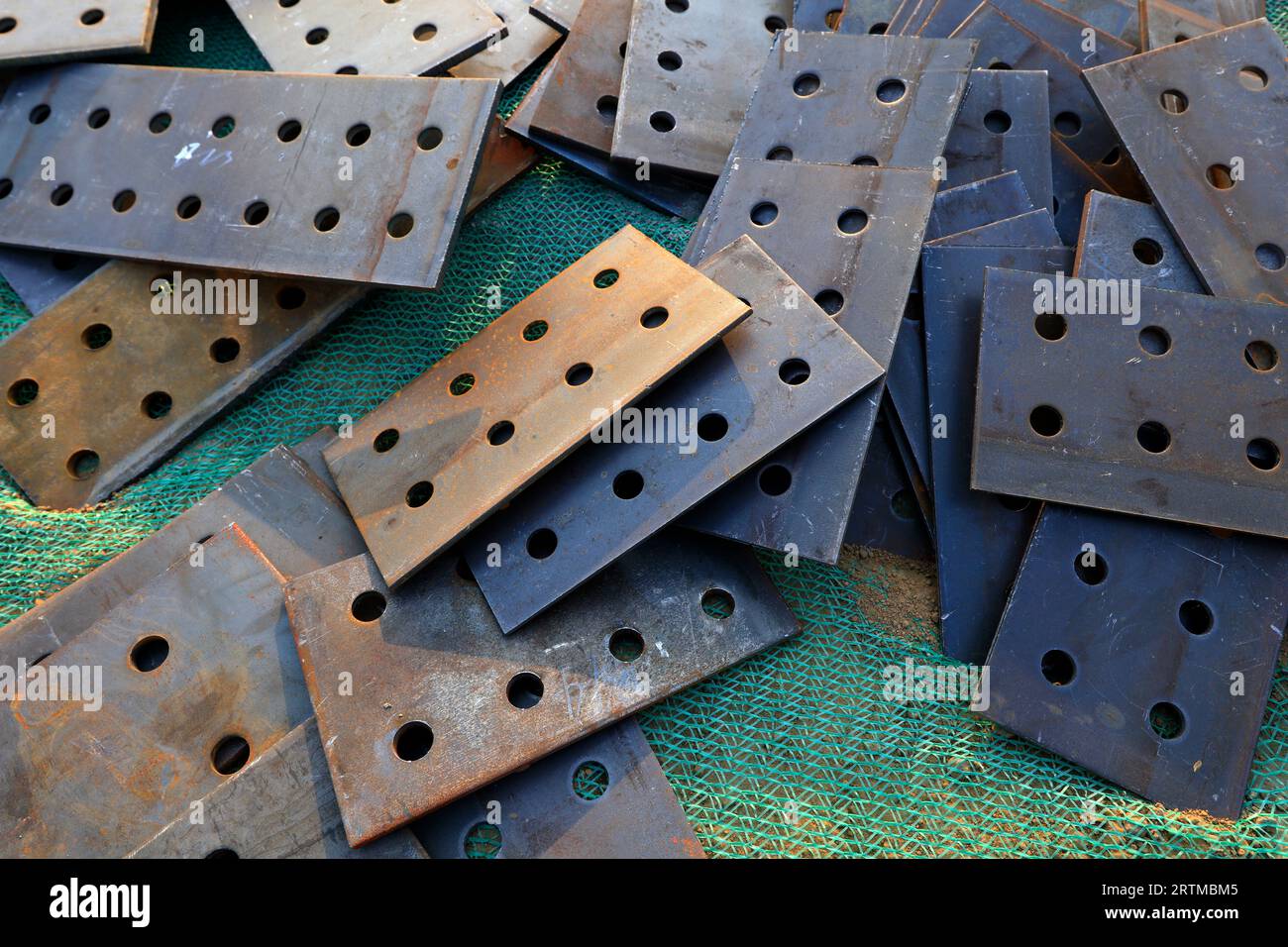 steel plates with holes stacked together Stock Photo - Alamy