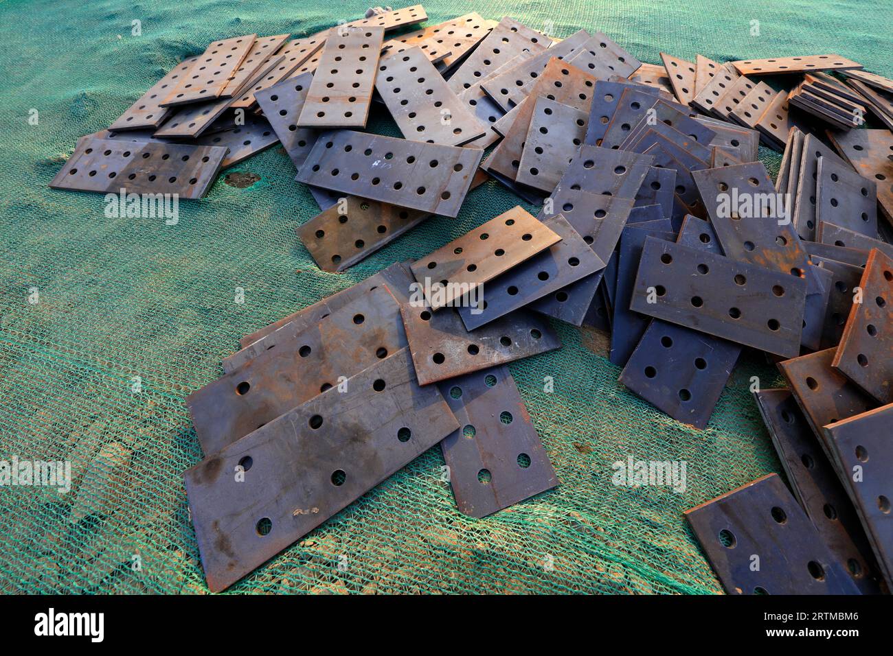 steel plates with holes stacked together Stock Photo - Alamy