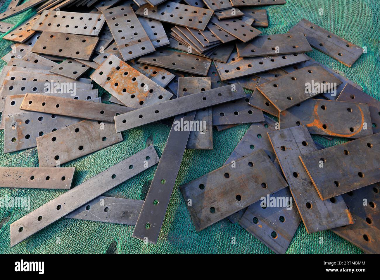 steel plates with holes stacked together Stock Photo - Alamy