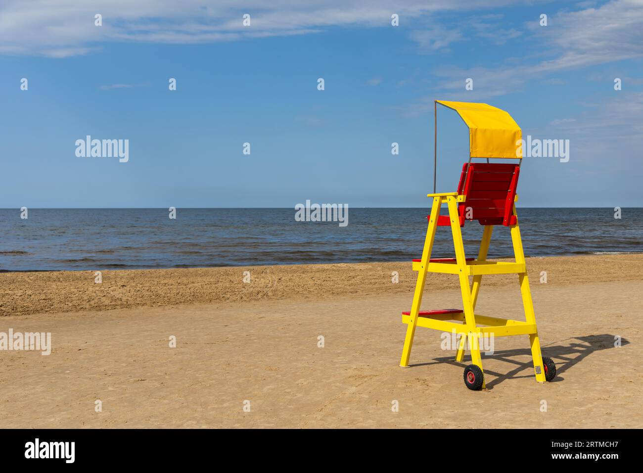 Empty lifeguard chair on the sea beach. Lifeguard equipment to support ...
