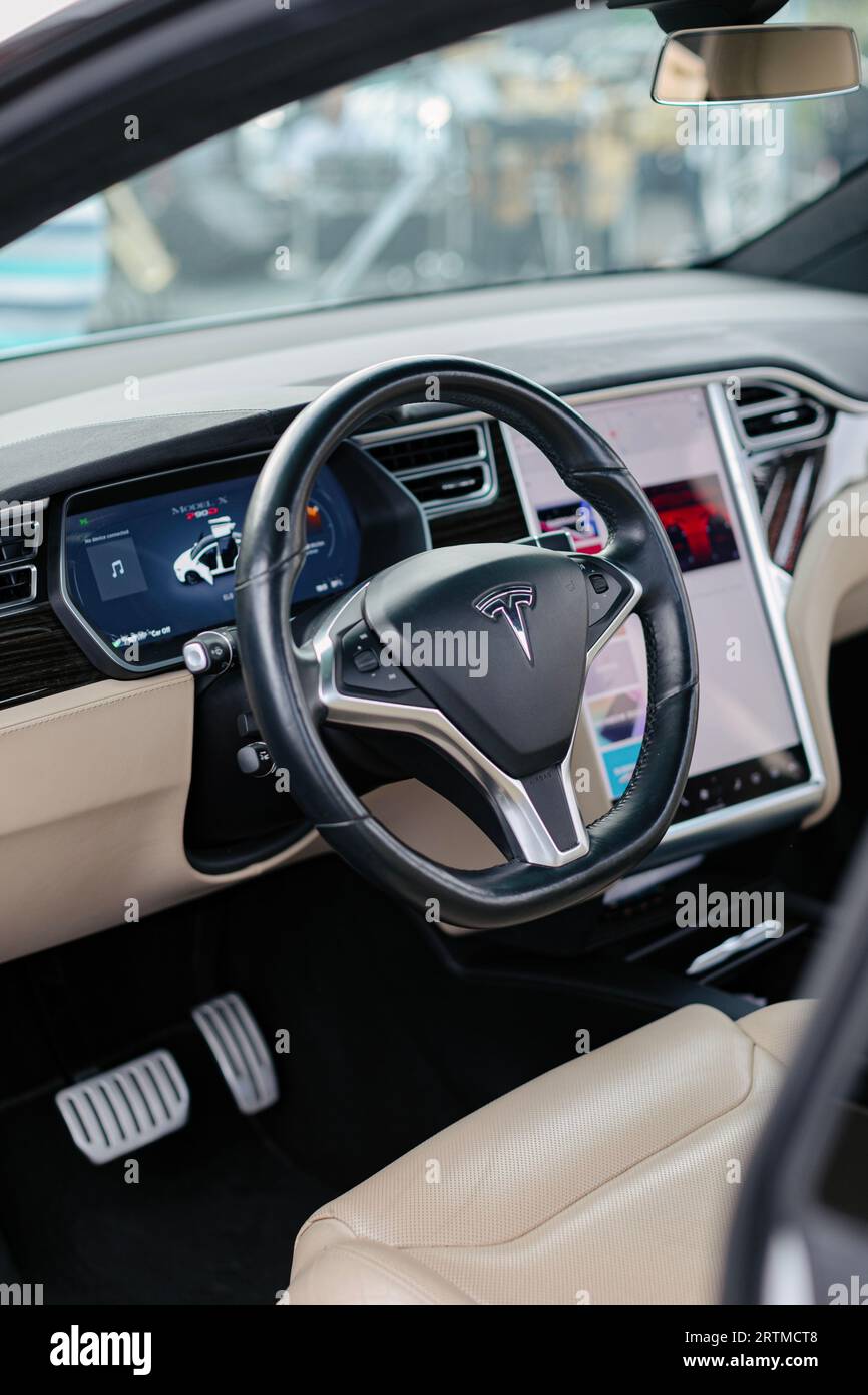 The interior of a Tesla vehicle in a tan and black leather finish Stock ...