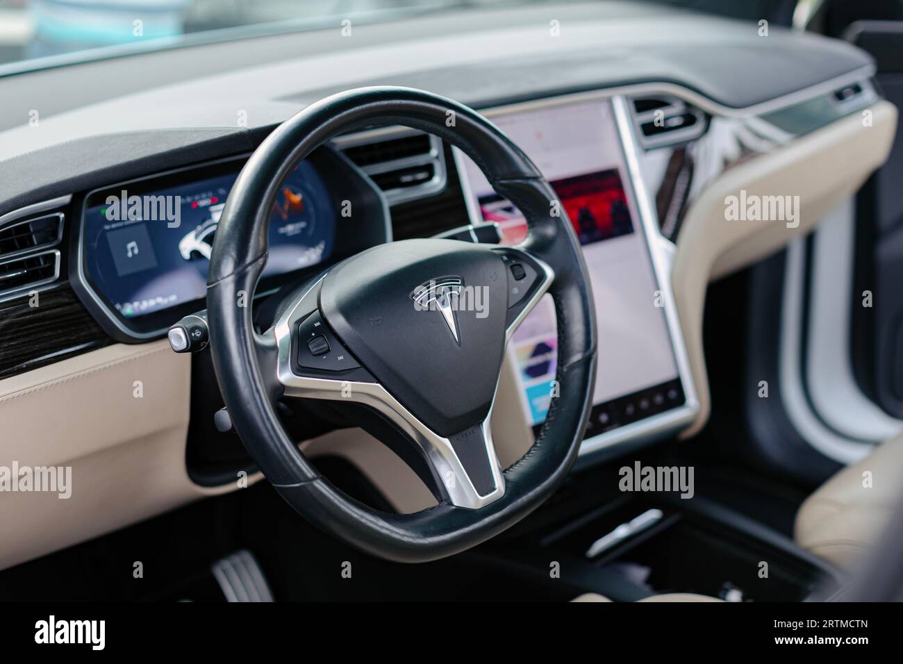 The interior of a Tesla vehicle in a tan and black leather finish Stock ...