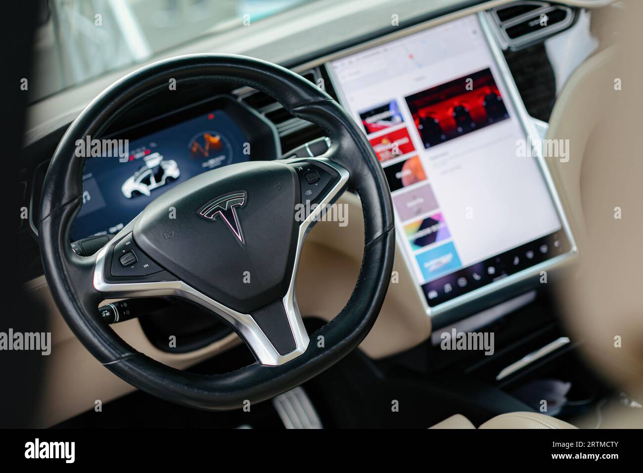 The interior of a Tesla vehicle in a tan and black leather finish Stock ...