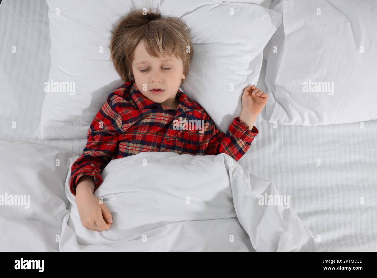 Little boy snoring while sleeping in bed, top view Stock Photo - Alamy
