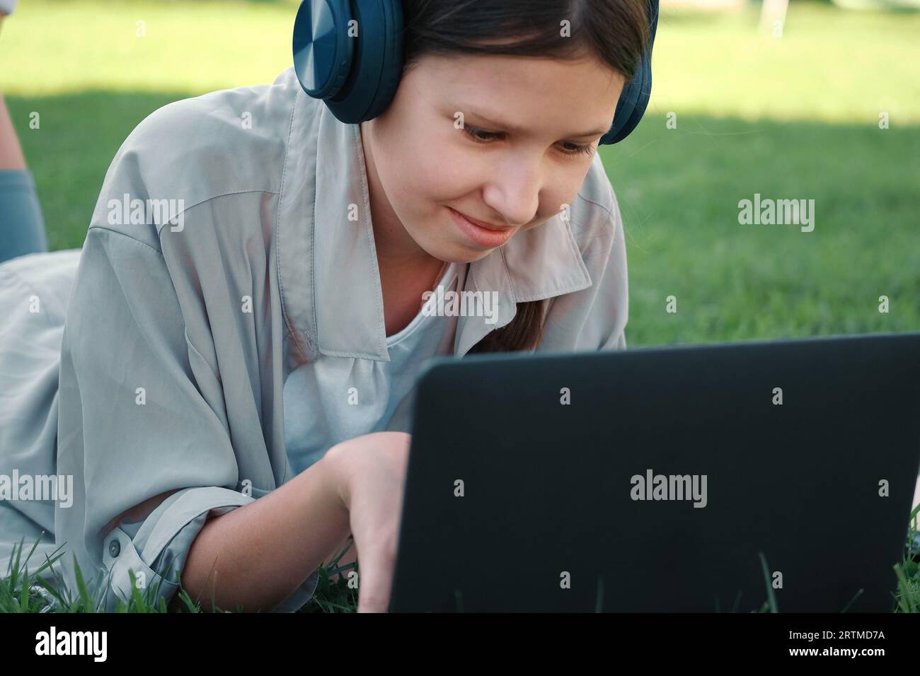 Teenage schoolgirl studying reading her books, tablet and notebook ...