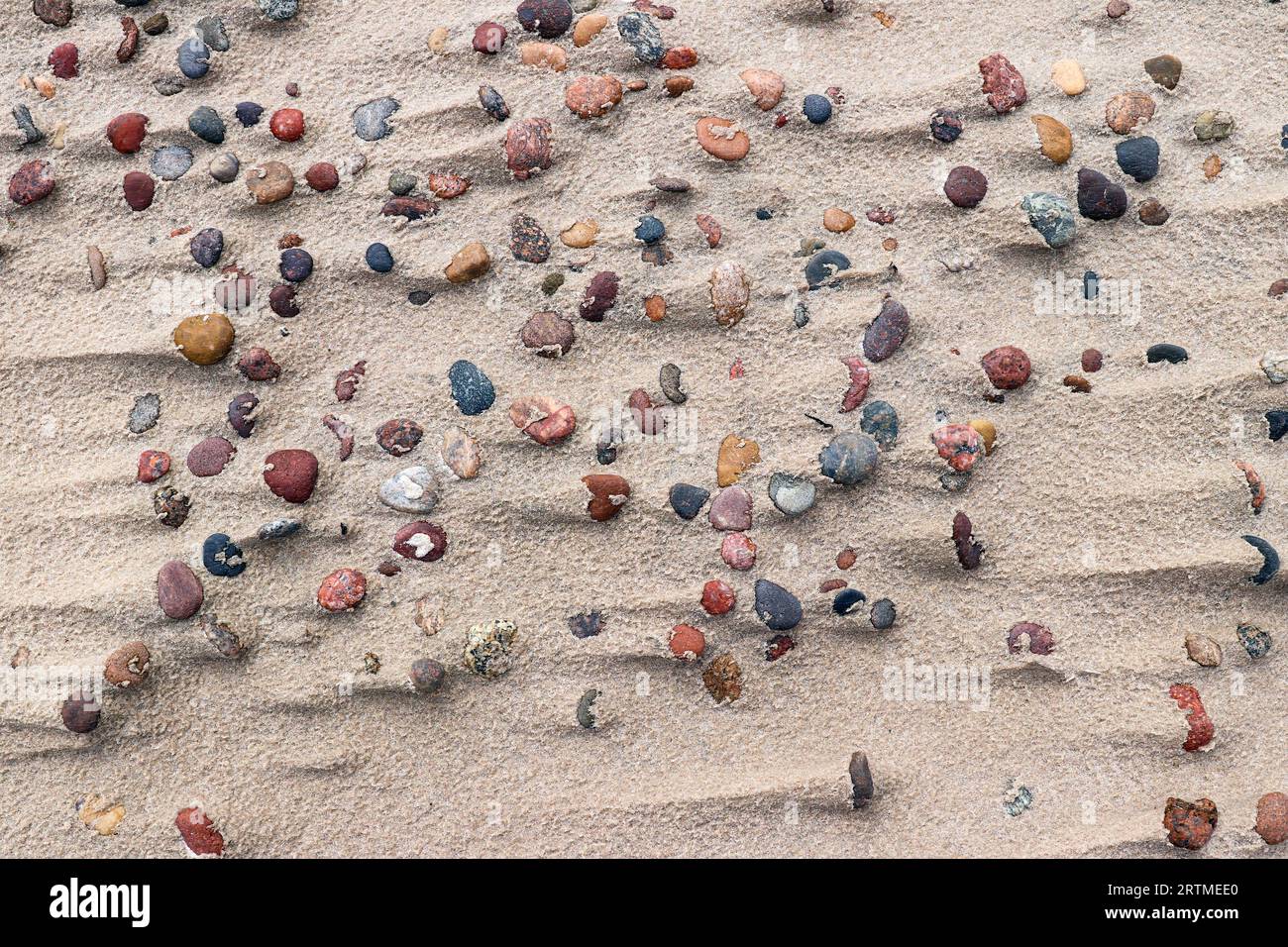 Detail of various sea pebbles on a sandy beach - gravel stones Stock ...