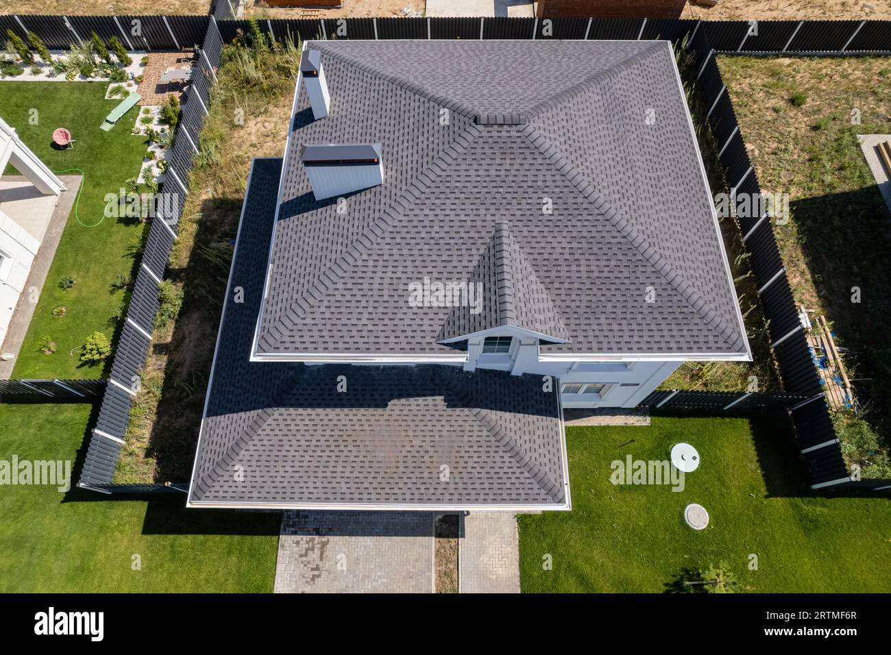 Close up view on asphalt roofing shingles Stock Photo - Alamy