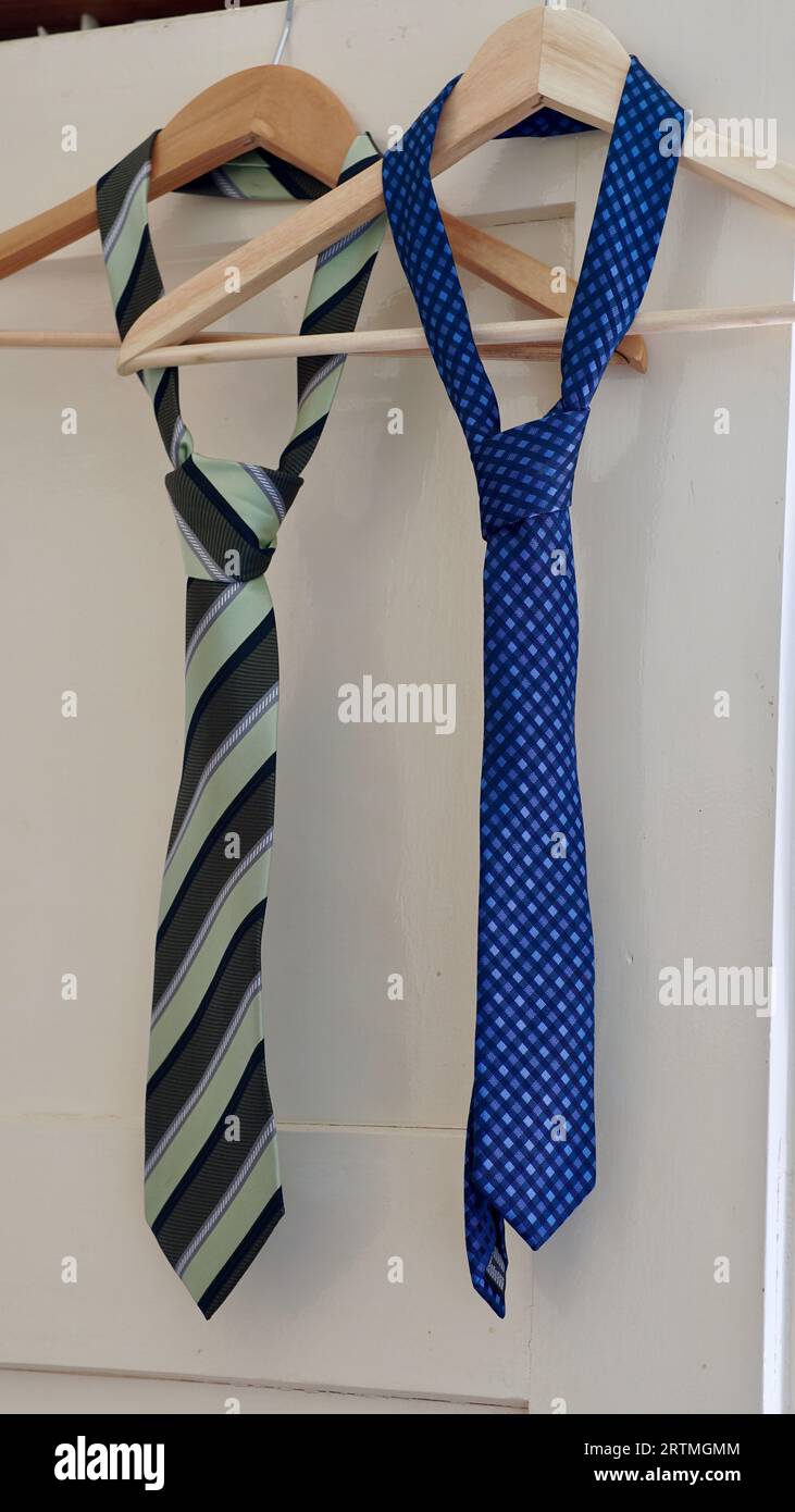 Two neckties on hangers Stock Photo - Alamy