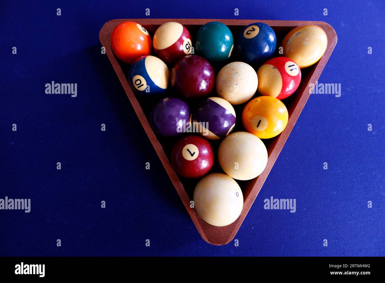 Pool or billiard balls arrangement inside billiards triangle. Burgundy ...