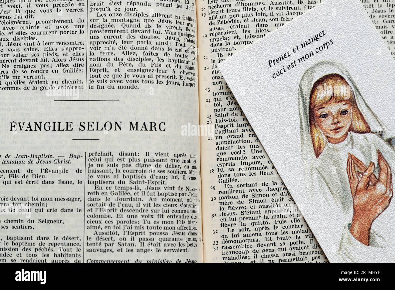 Open bible in french with religious image. Gospel of Mark. First ...
