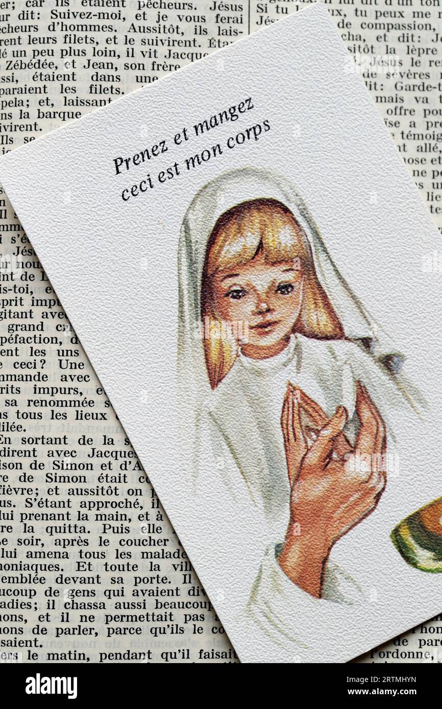 Open bible in french with religious image. First Communion Stock Photo ...