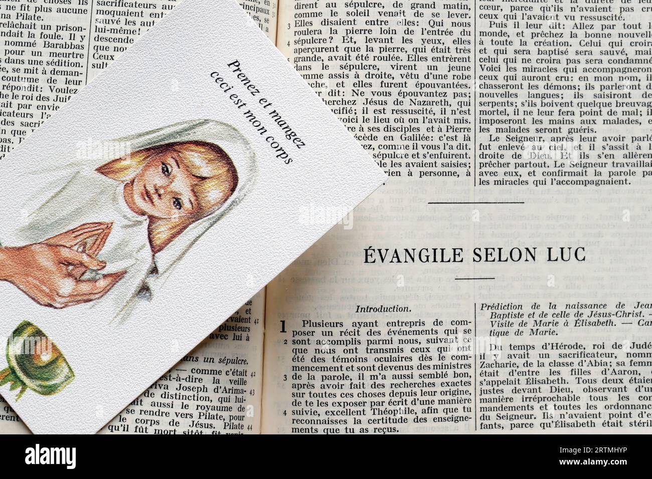 Open bible in french with religious image. Gospel of Luke. First ...