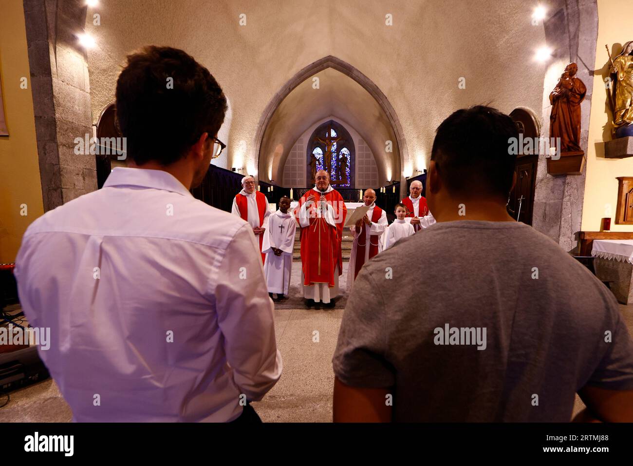 Saint Nicolas church. Catholic mass. Adult confirmation ceremony ...