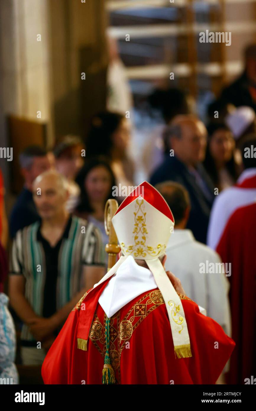 St Francis de Sales basilica. Catholic mass. Bishop wearing white miter ...