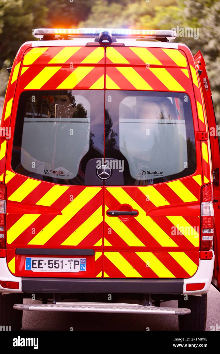 Image of an ambulance driving in the street. France Stock Photo - Alamy
