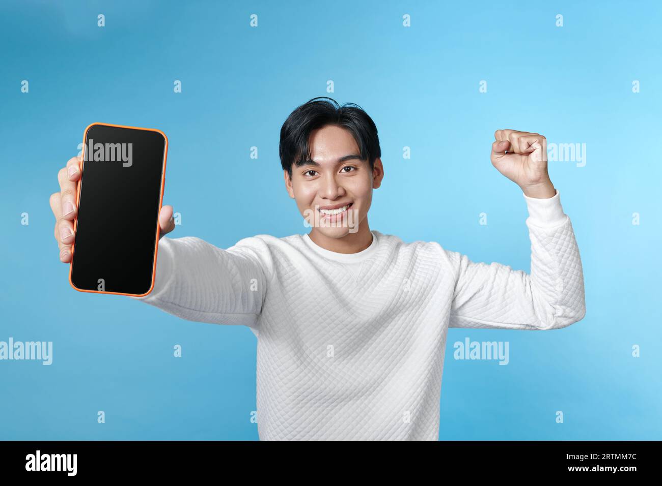 Asian handsome young, holding a big giant huge smart phone screen ...