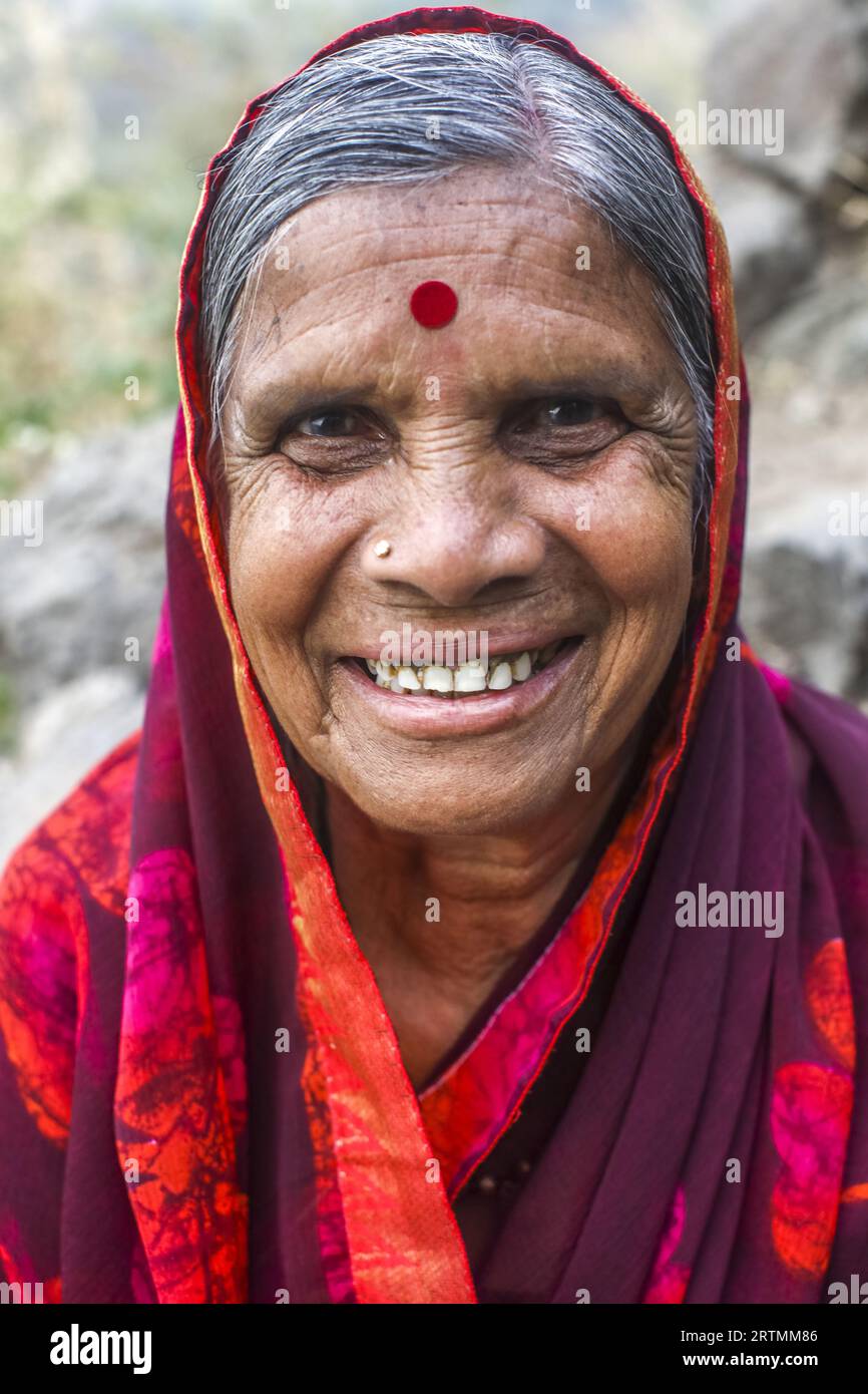 Smiling Hindu woman wearing a red sari, Daulatabad, Maharashtra, India ...