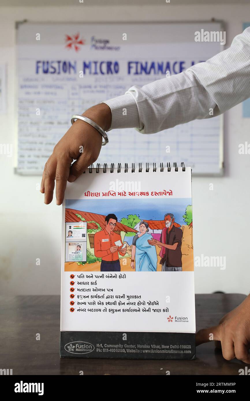 Microfinance institution flip charts in Sagbara, Gujarat, India Stock ...