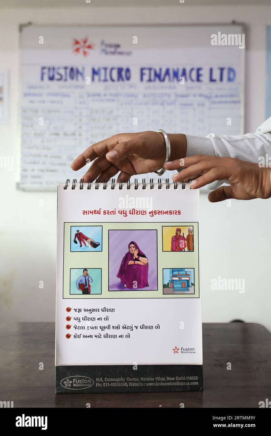 Microfinance institution flip charts in Sagbara, Gujarat, India Stock ...