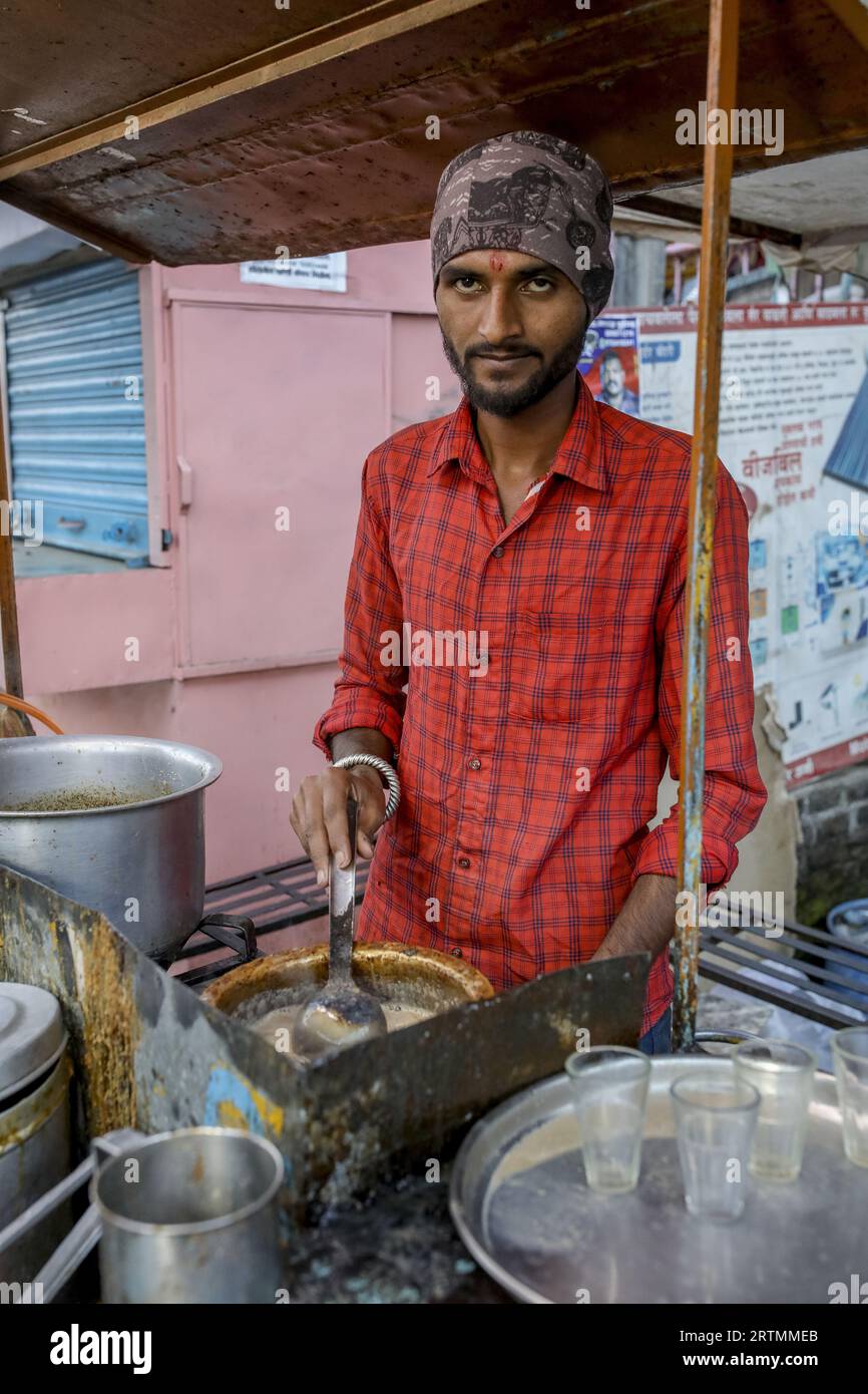 Man making tea in a village tea stall in Maharashtra, India Stock Photo ...