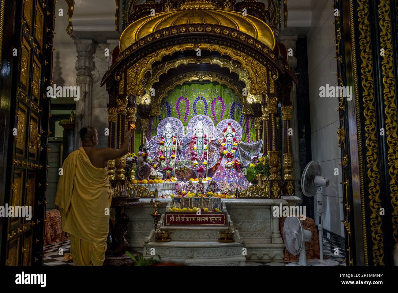 Priest performing ritual in ISKCON temple in Juhu, Mumbai, India Stock Photo - Alamy