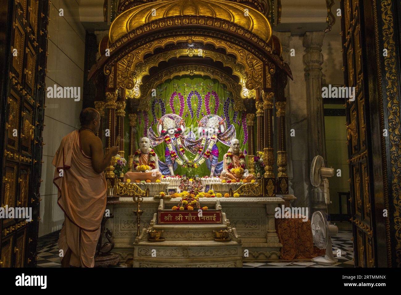 Priest performing ritual in ISKCON temple in Juhu, Mumbai, India Stock ...