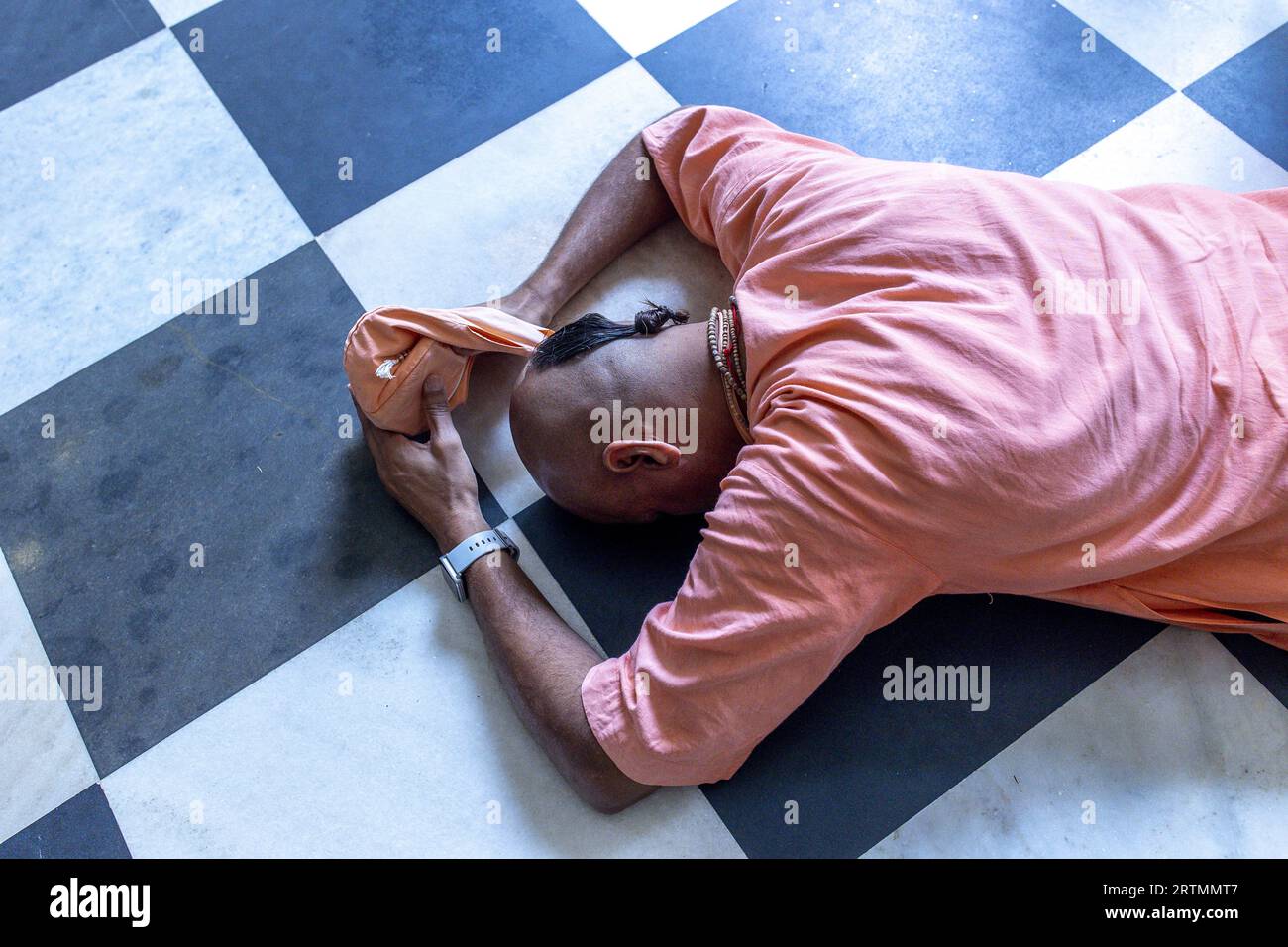 Devotee prostrating in ISKCON temple in Juhu, Mumbai, India Stock Photo - Alamy