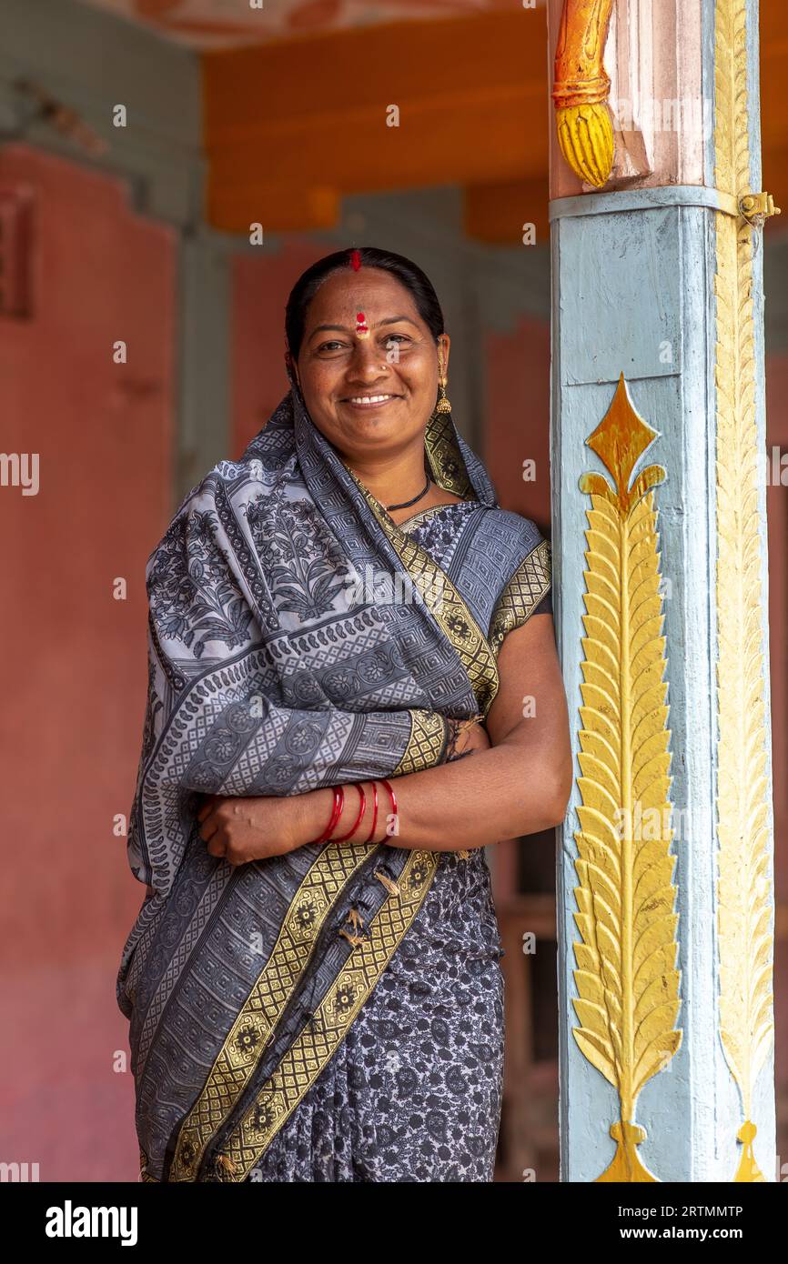 Woman standing in a hindu temple in Babra village, Maharashtra, India ...